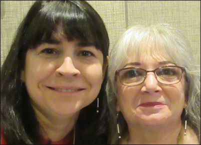 We see a close-up of Eileen and Mary, wearing earrings made of beads ...