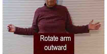 photo shows a woman with har elbows close to her body, and forearms ...